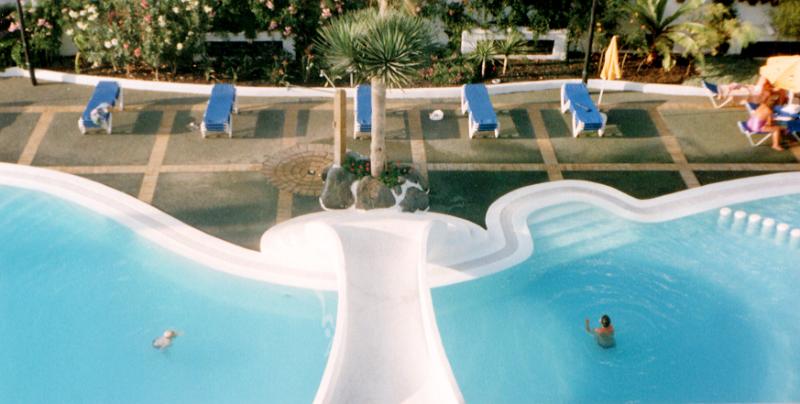 Free image of High angle view of a sparkling blue swimming pool