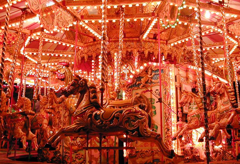 Free image of Close up of an illuminated carousel at a funfair