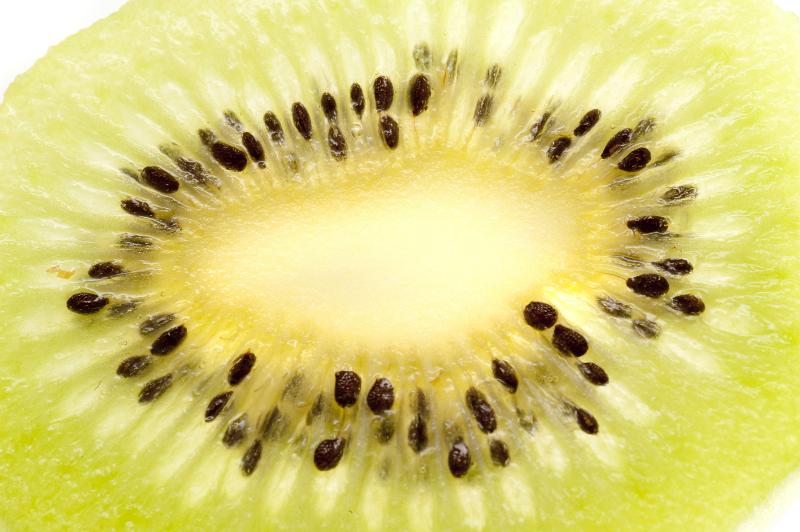 Free image of Section of a fresh kiwifruit with seeds