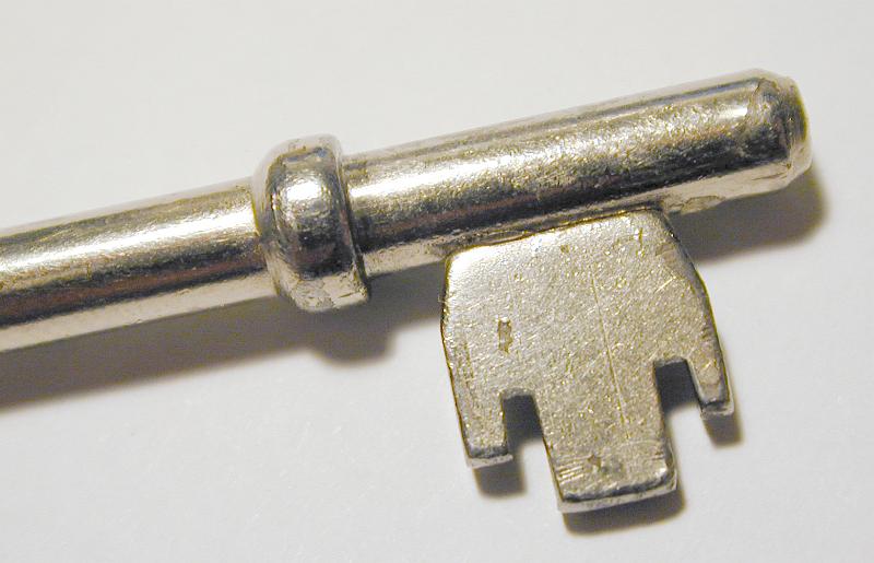Free image of Metallic lever lock key with symmetrical wards