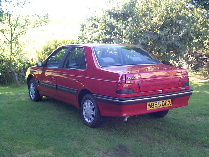 Free image of Old red peugeot 405